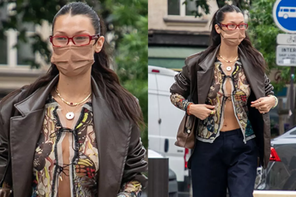 Celebrity Street Style: Bella Hadid in een kanten blouse voor een wandeling in Parijs