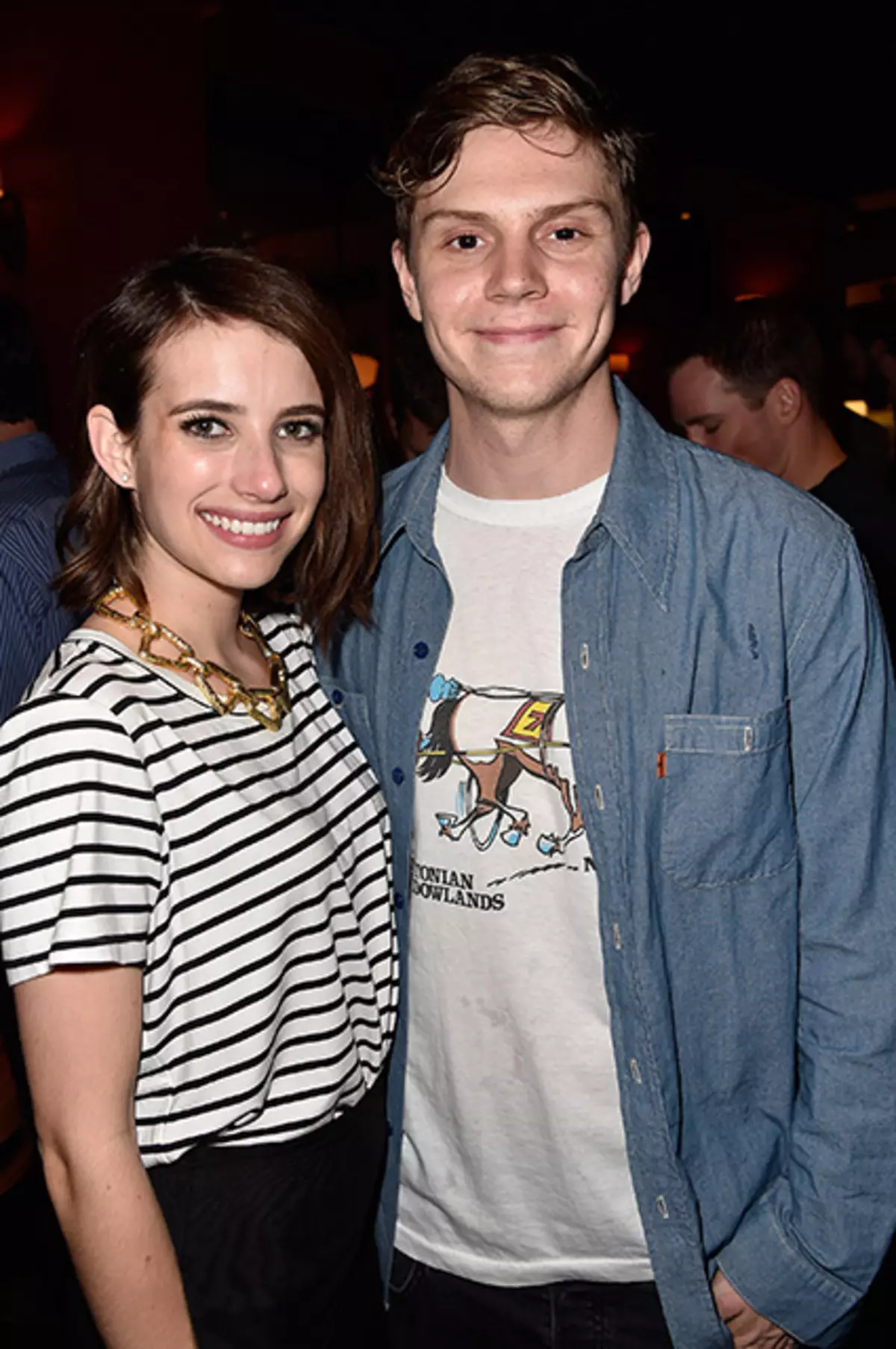 Emma Roberts at Evan Peters.