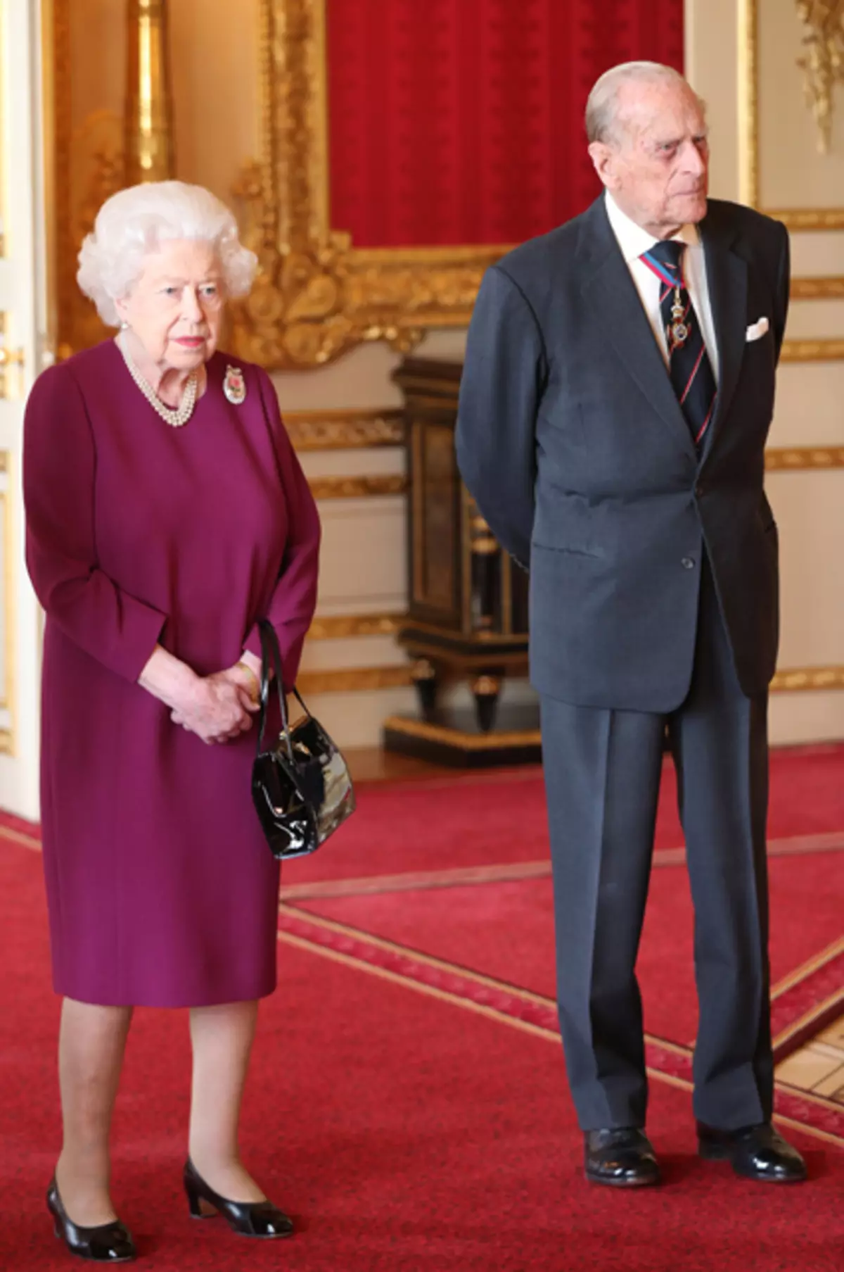 Queen Elizabeth II at Prince Philip.