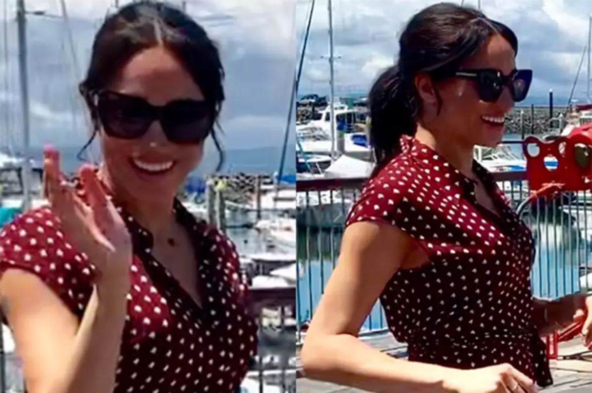 Megan plante i en romantisk polka dot dress hviler på en yacht i Australia